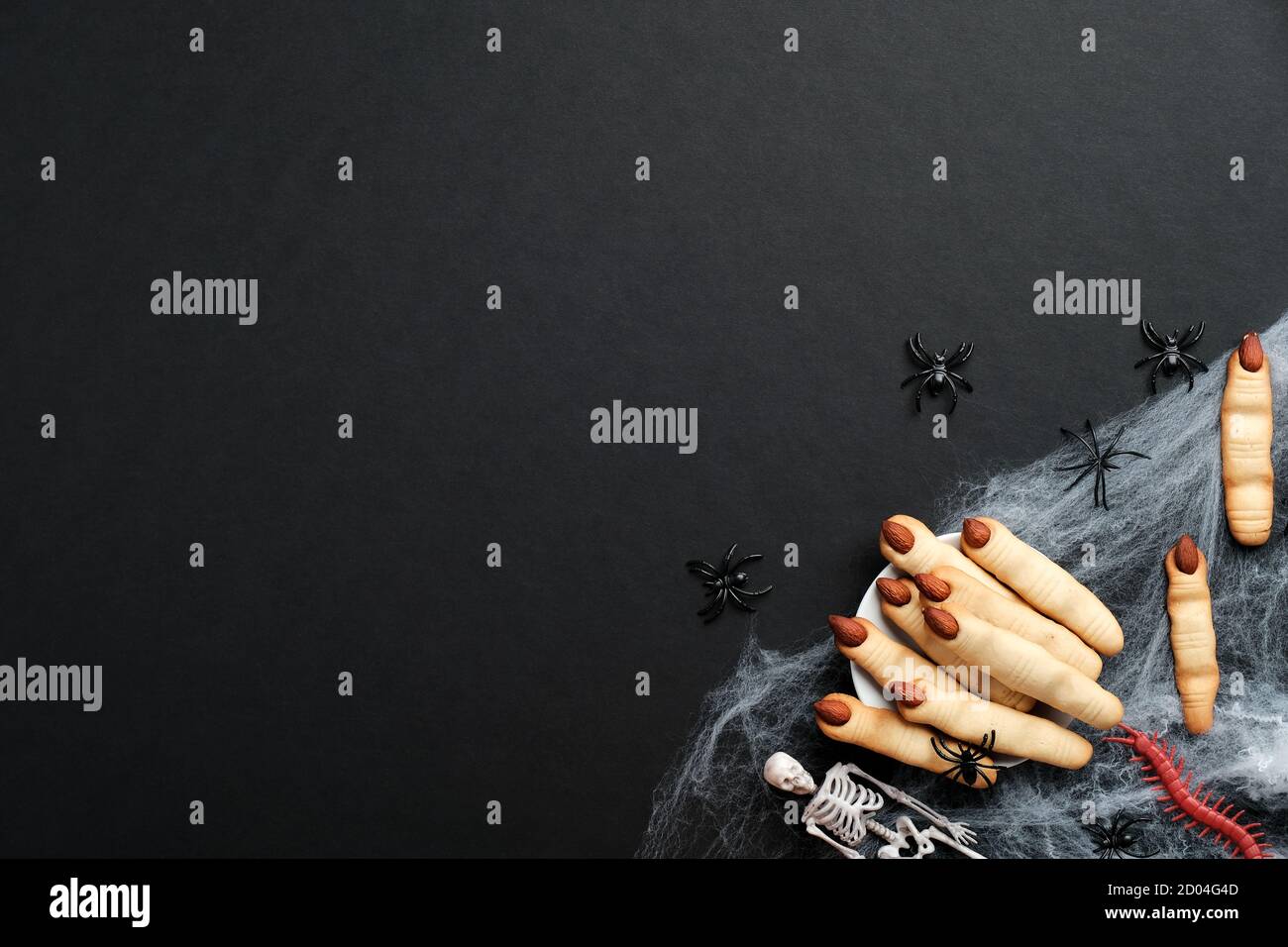 Halloween composition. Witch hand fingers, spiderweb, spiders ...