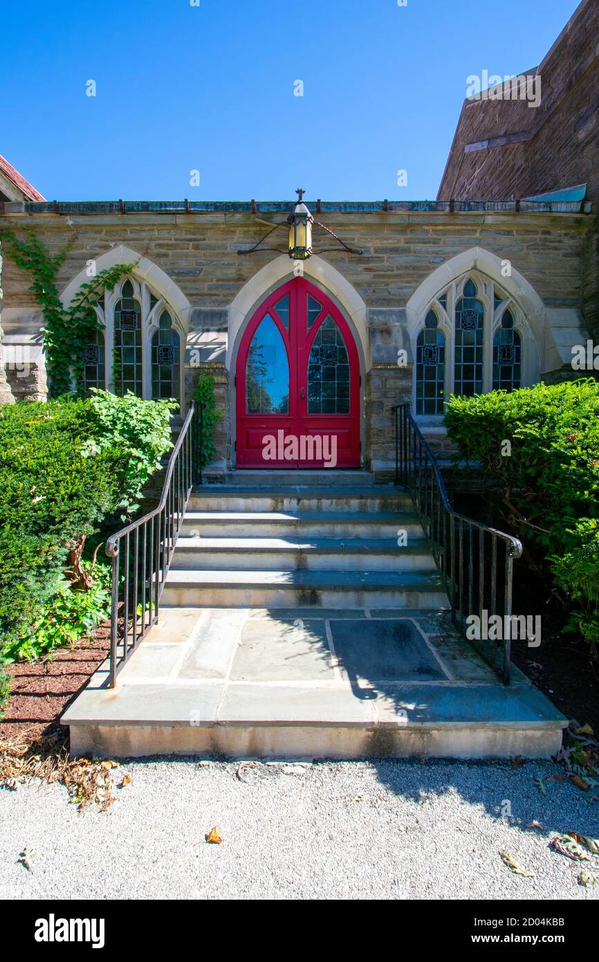 Steps Leading Up to a Red Door on a Cobblestone Church With Trimmed ...