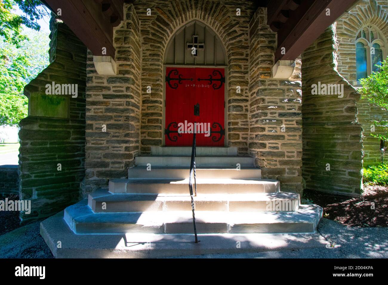 Steps Leading Up to a Red Door on a Cobblestone Church in a Covered ...