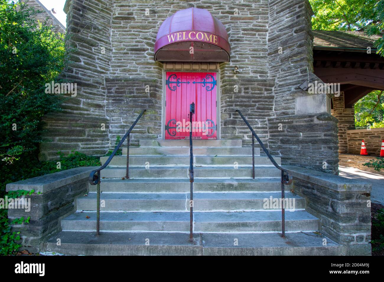 Steps Leading Up to a Red Door on a Cobblestone Church With a Welcome ...