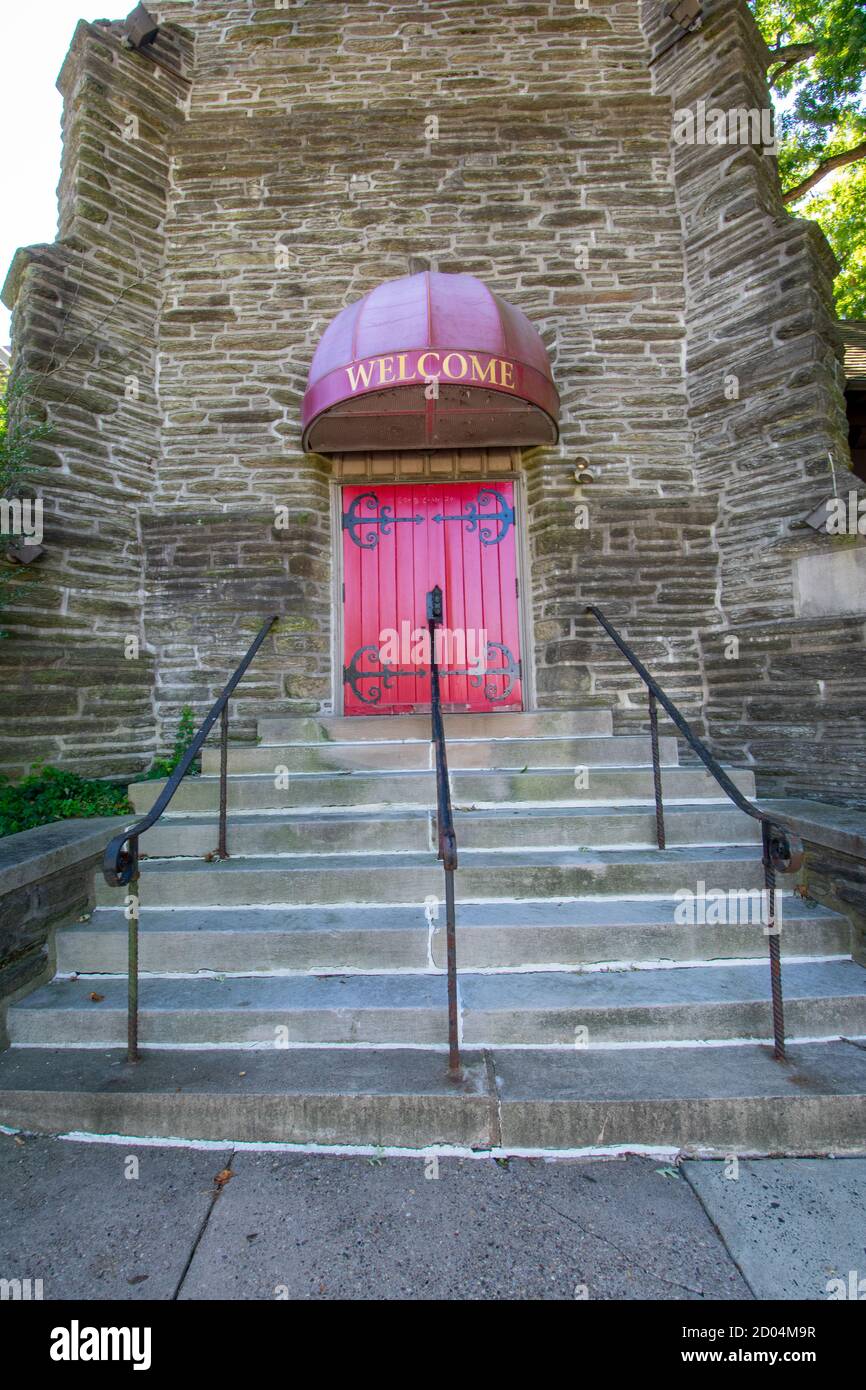 Steps Leading Up to a Red Door on a Cobblestone Church With a Welcome ...