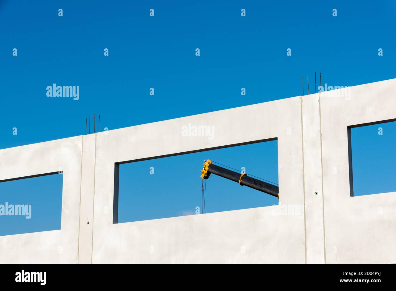A crane behind a window of the modular building Stock Photo - Alamy