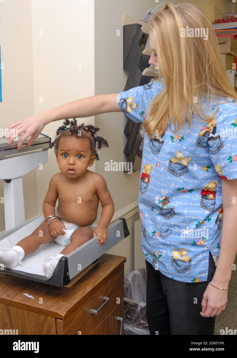 Baby girl goes to the doctor for a checkup. Photo by Liz Roll Stock ...