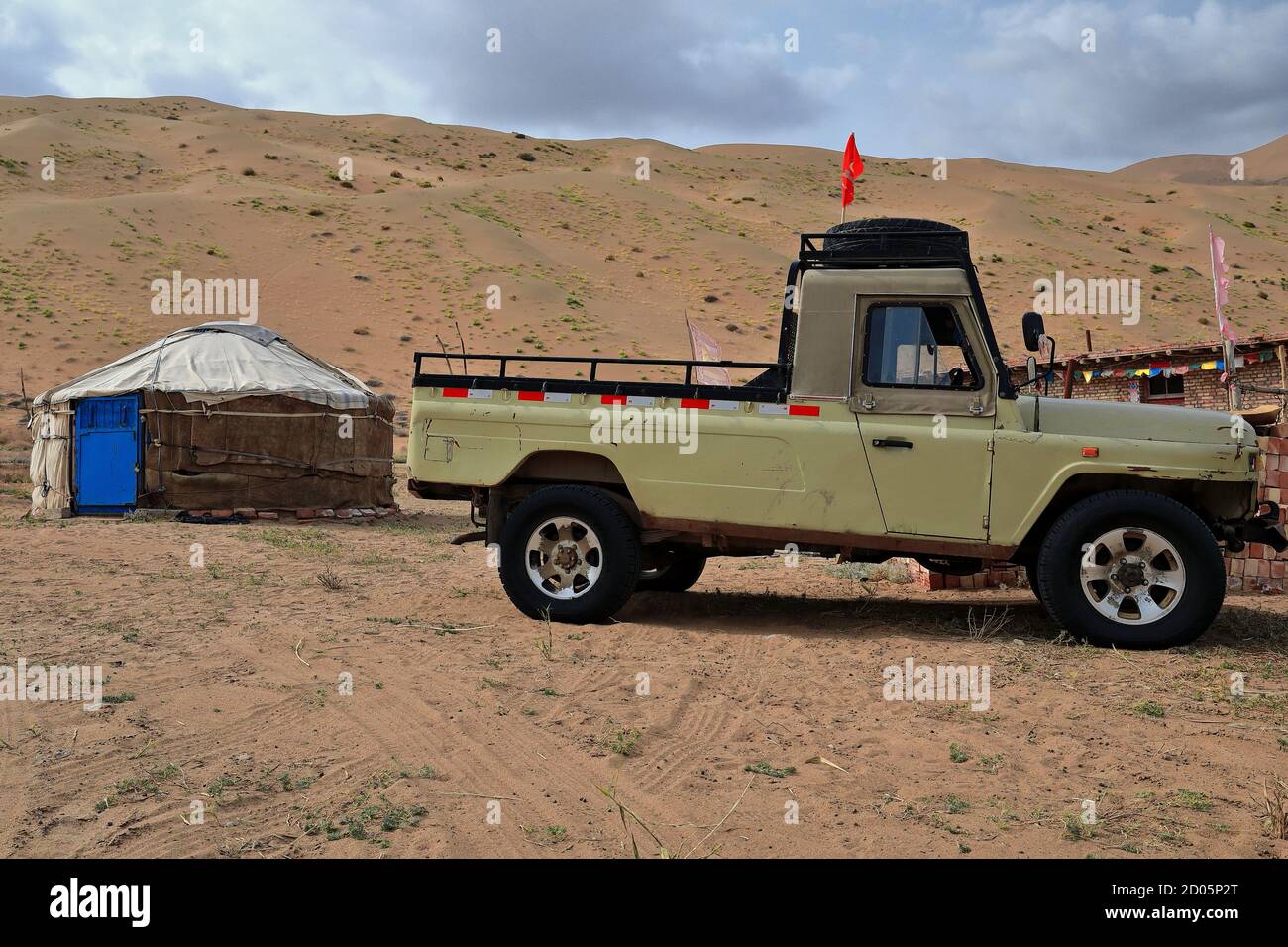 Abandoned 4WD car beside Lake Tamaying-nomadic yurt and house ...