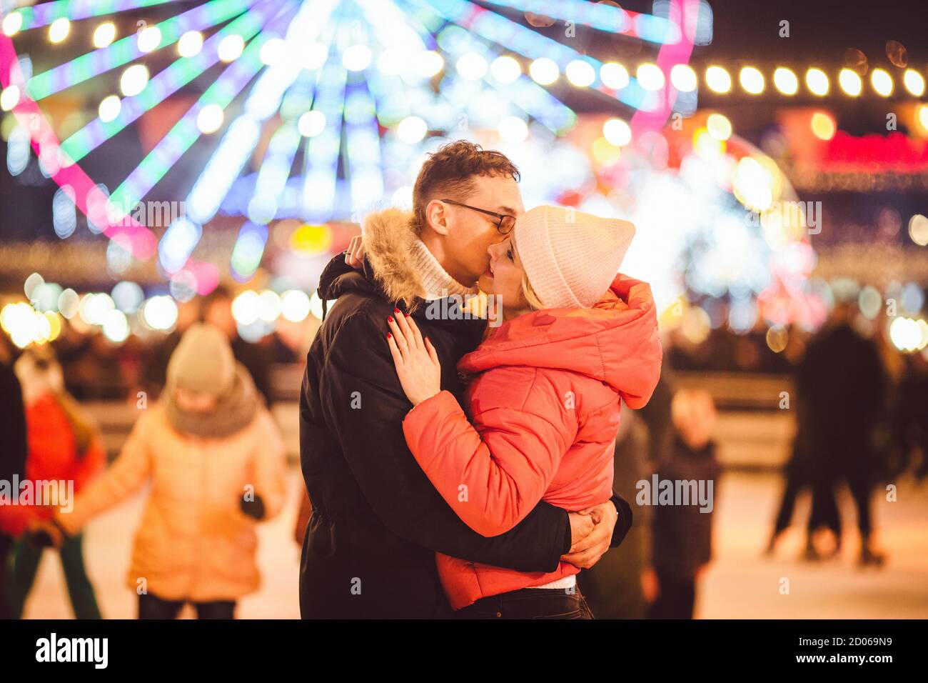 Ice skating together. Romantic winter vacation in ice arena. Young ...