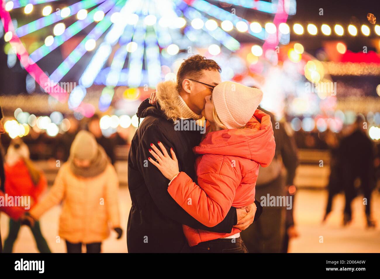 Ice skating together. Romantic winter vacation in ice arena. Young ...