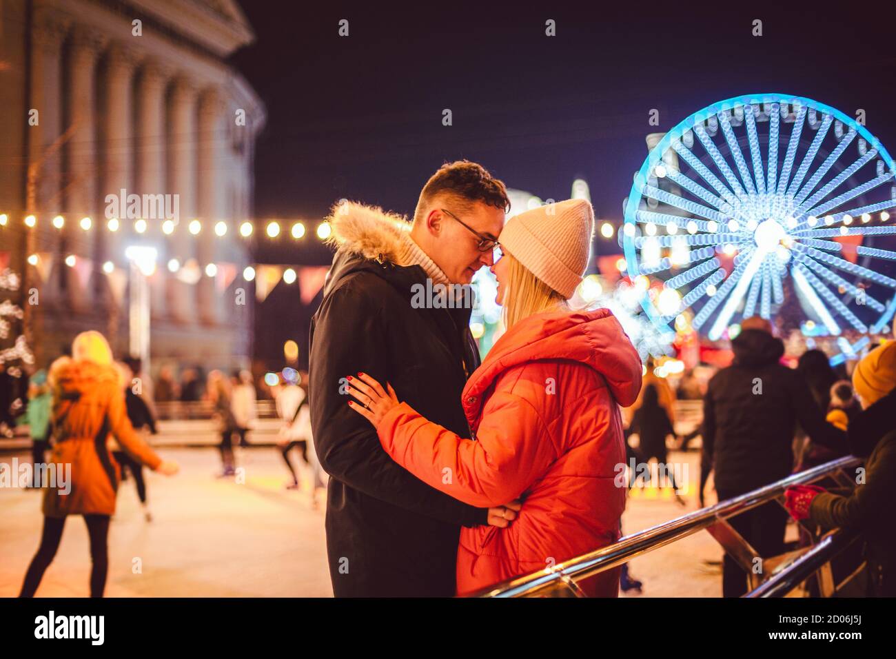 Ice skating together. Romantic winter vacation in ice arena. Young ...