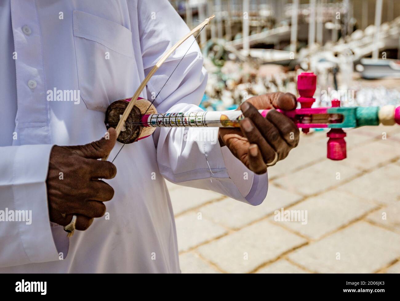 Jordanian Vendor Demonstrates How to Play Native Three String ...