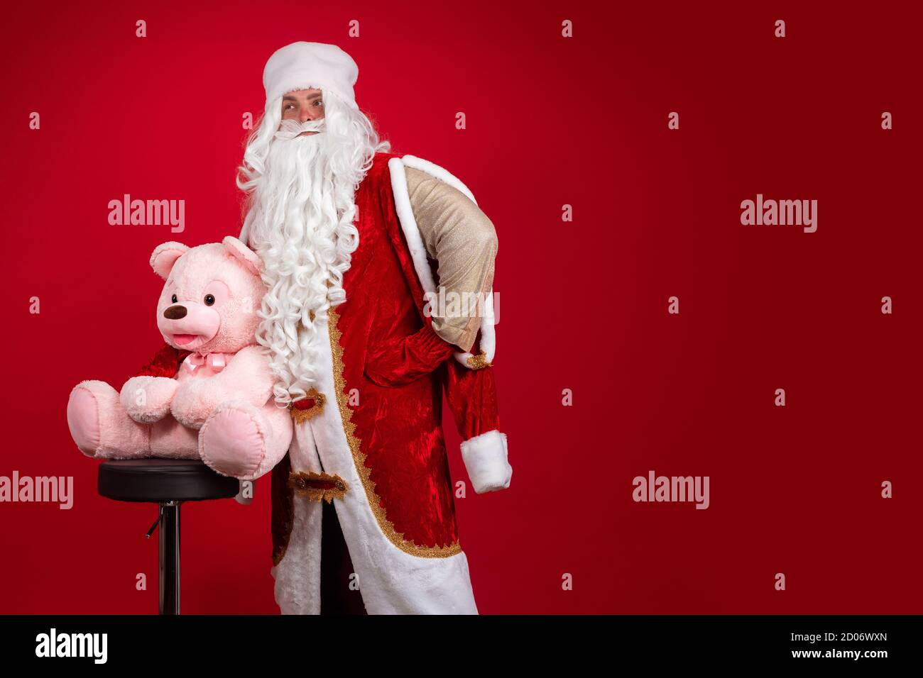 Emotional Santa Claus with a long white beard in a red coat and white ...