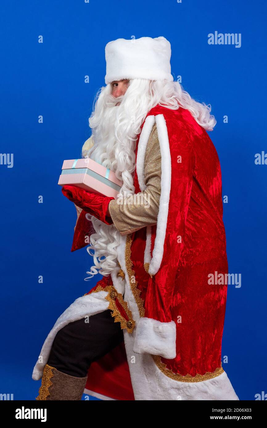Emotional Santa Claus with a long white beard in a red coat and white ...