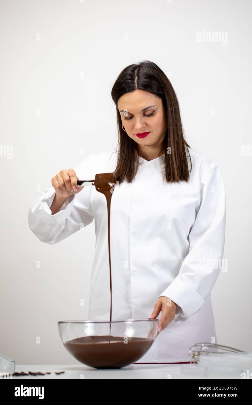 handmade chocolate Candy manufacturing. chocolatier makes handmade ...