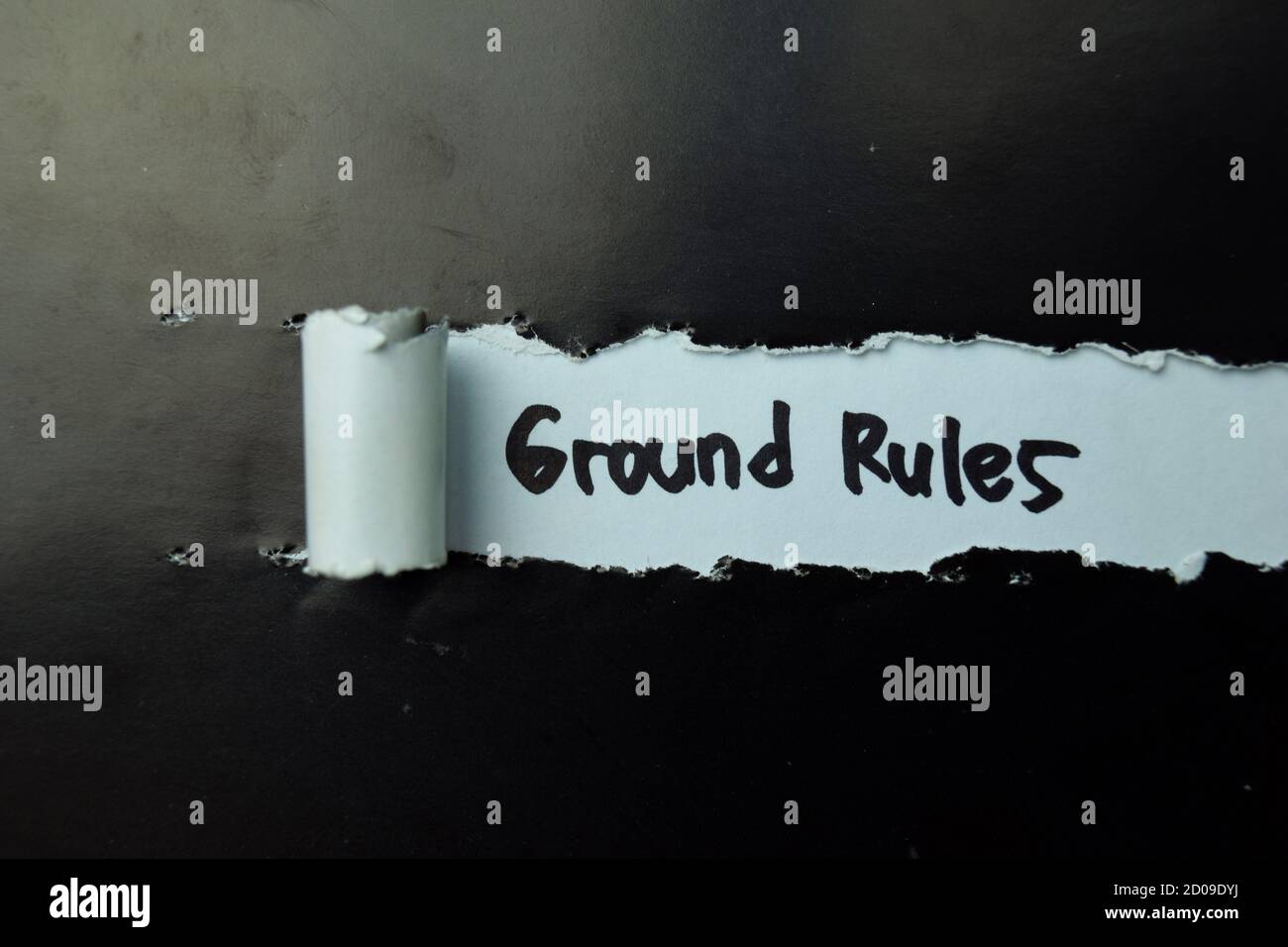 Ground Rules Text written in torn paper Stock Photo - Alamy