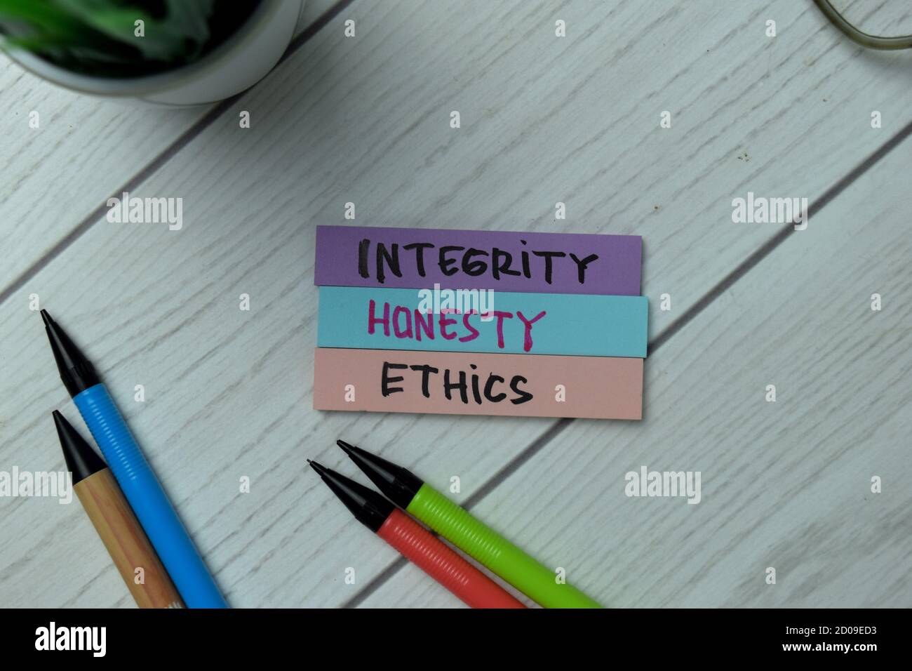 Integrity, Honest, Ethics write on sticky notes isolated on office desk ...