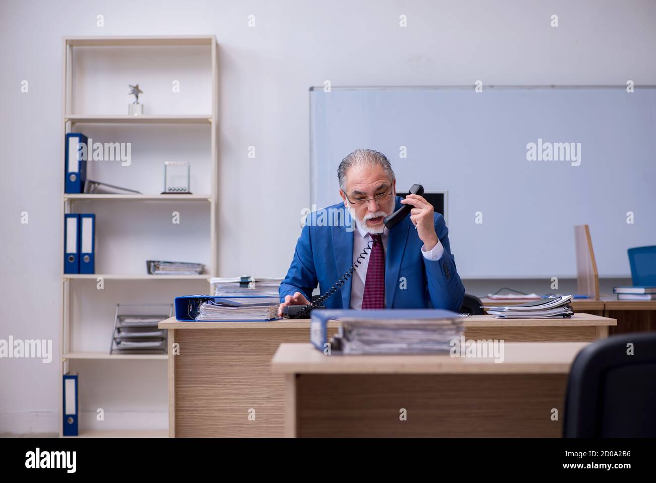 Male boss employee working in the office Stock Photo - Alamy