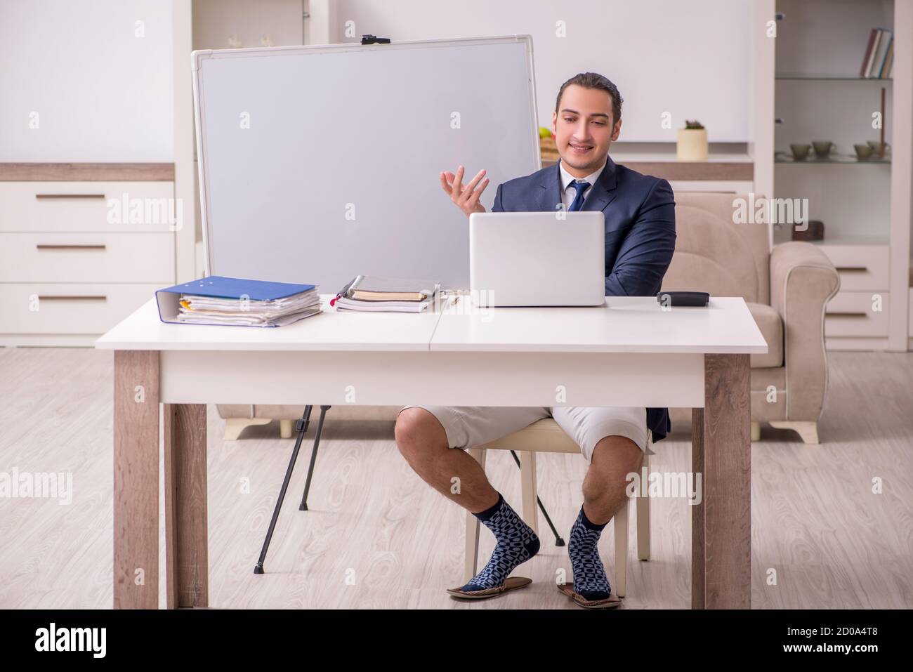 Male employee working at home during pandemic disease Stock Photo - Alamy