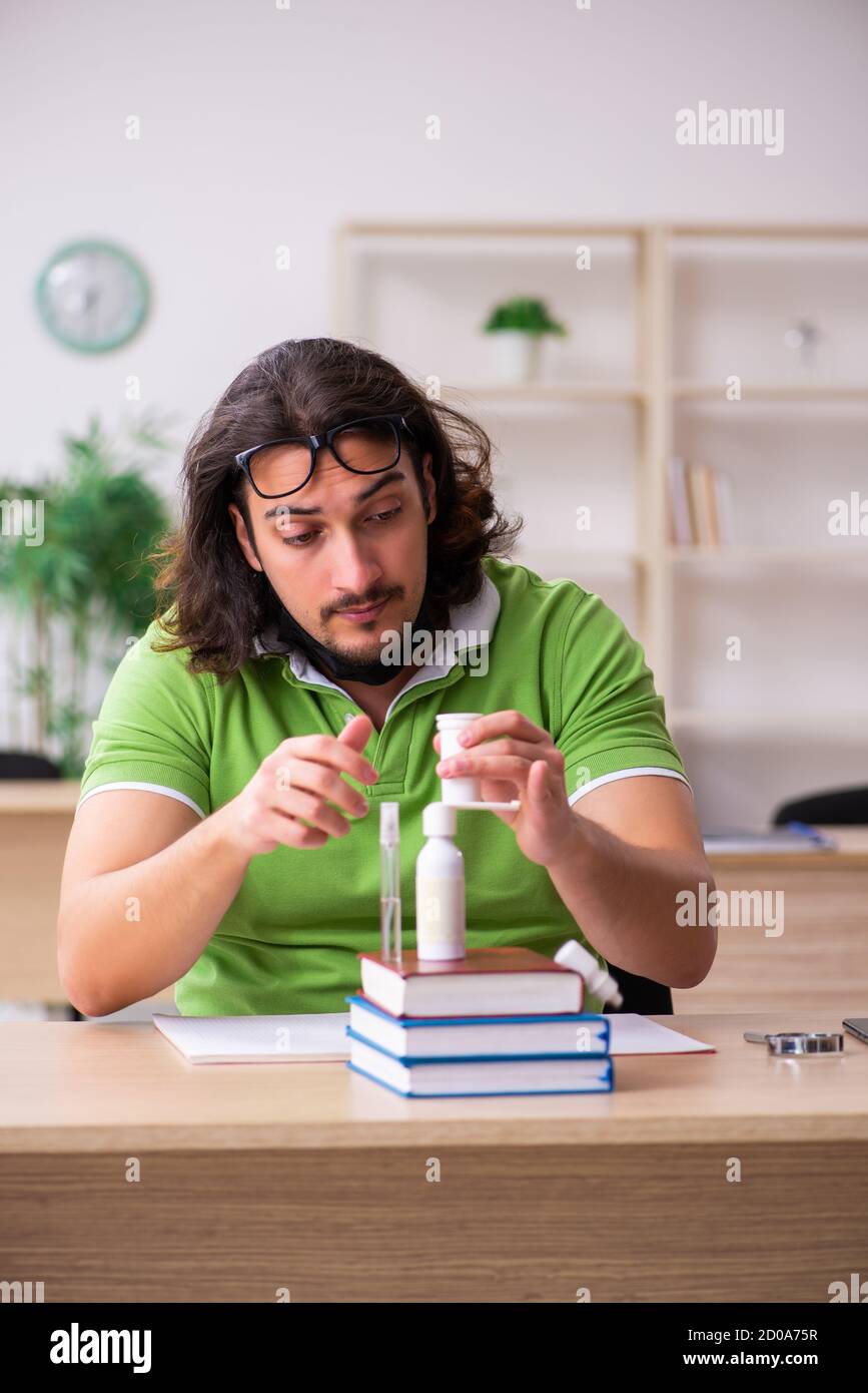 Young man student studying at the home in self-isolation concept Stock ...