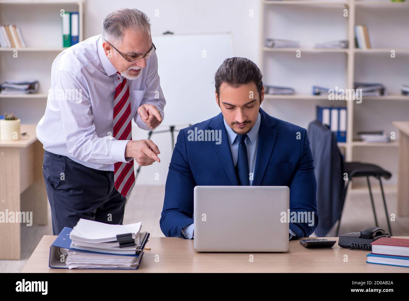 Two employees in the office environment Stock Photo - Alamy