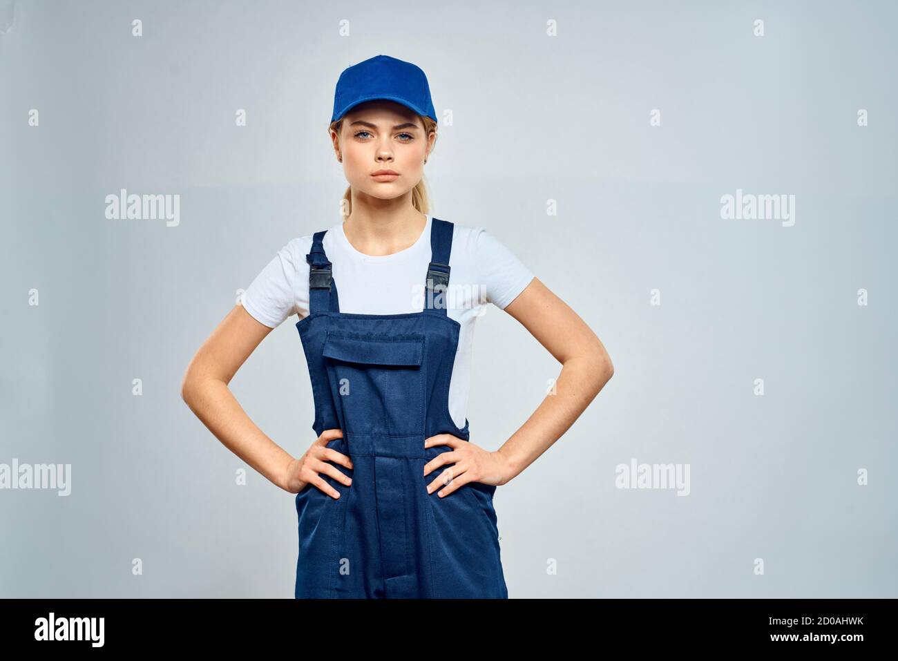 woman in work uniform blue cap service delivery service light ...