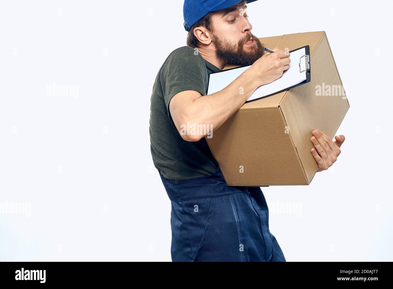 Working male courier with box in hand documents delivery service light ...