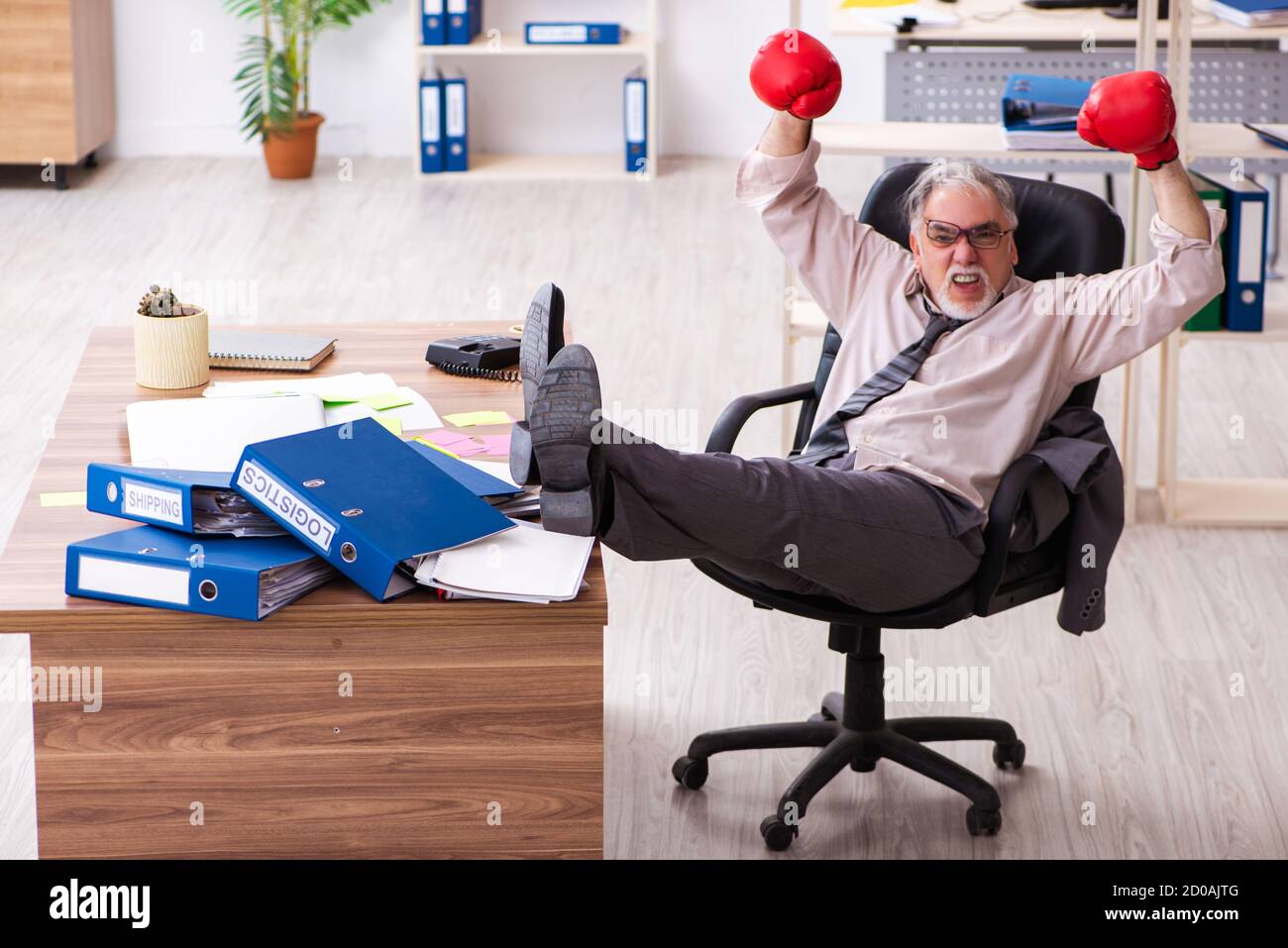 Businessman angry and furious at his workplace Stock Photo - Alamy