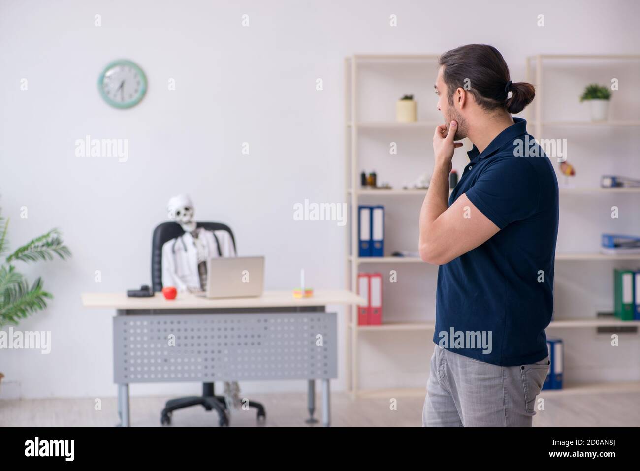 Young man visiting dead doctor in hospital Stock Photo - Alamy