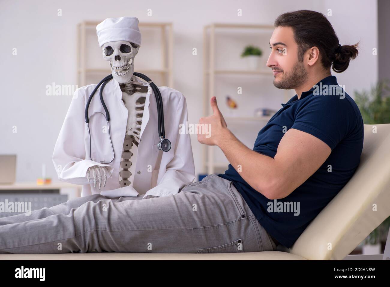 Young man visiting dead doctor in hospital Stock Photo - Alamy