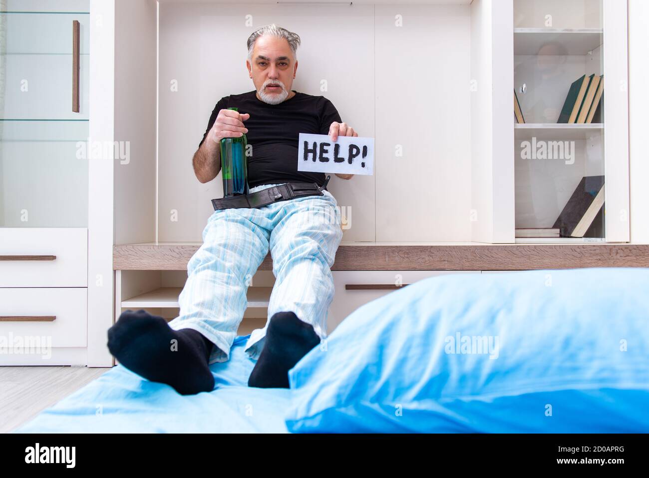 Old man in depression mode at home Stock Photo - Alamy