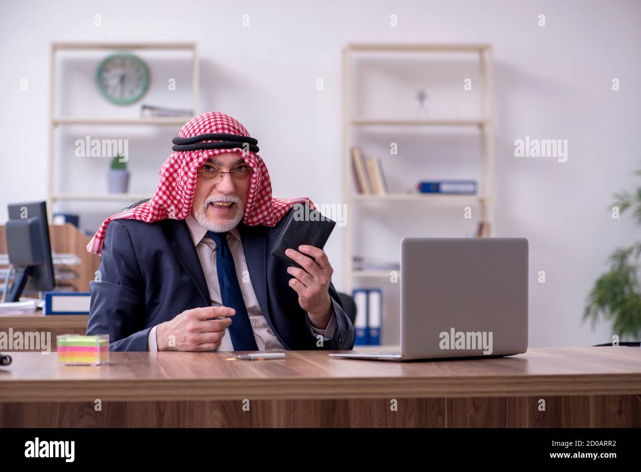 Old arab businessman working in the office Stock Photo - Alamy