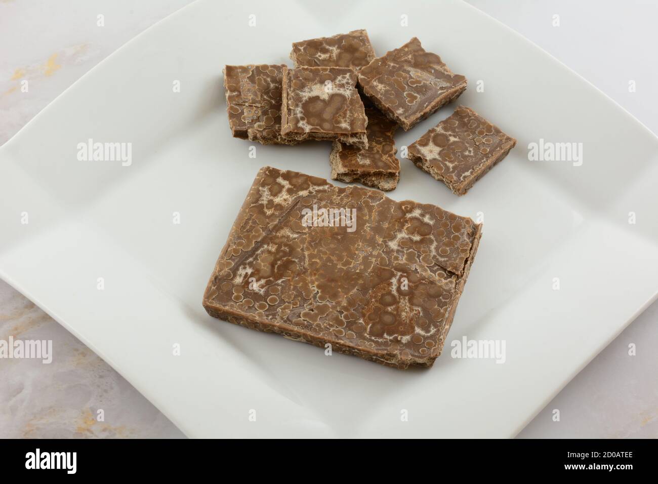 Chocolate bar and pieces damaged by poor storage or shipping with ...