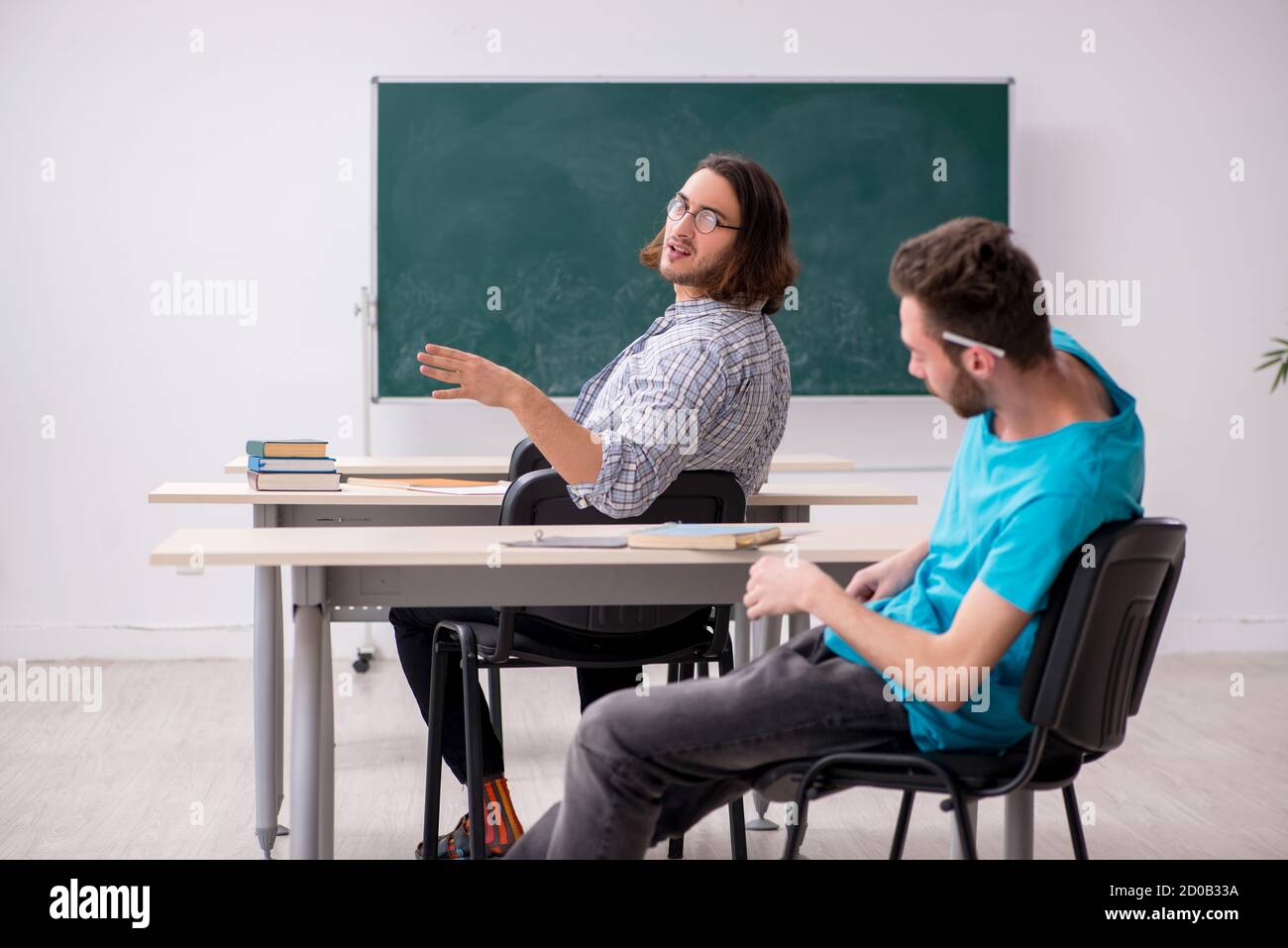 Male pupils in bullying concept in the classroom Stock Photo - Alamy