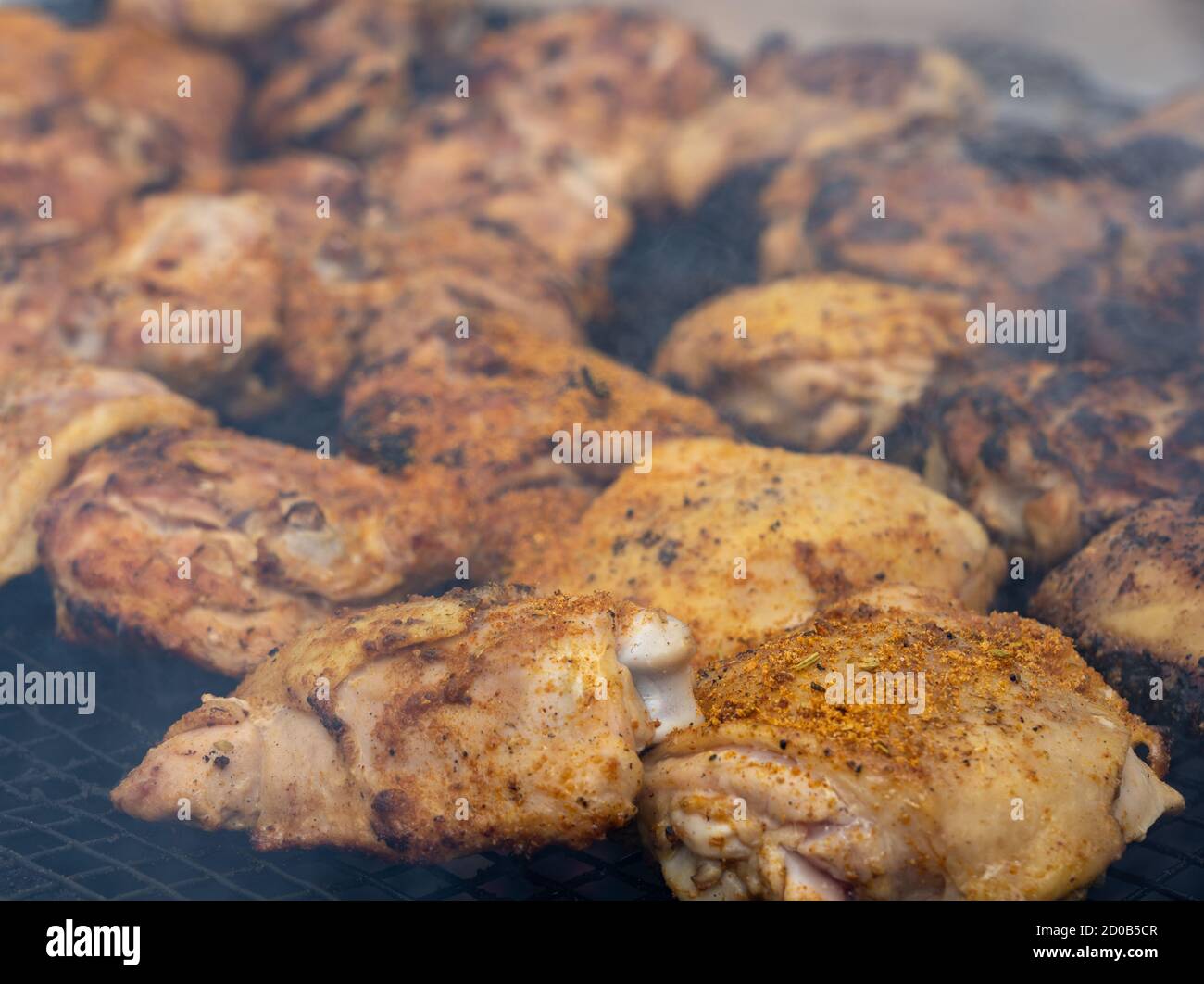 Making BBQ chicken on a wood fired grill in the outdoors Stock Photo ...