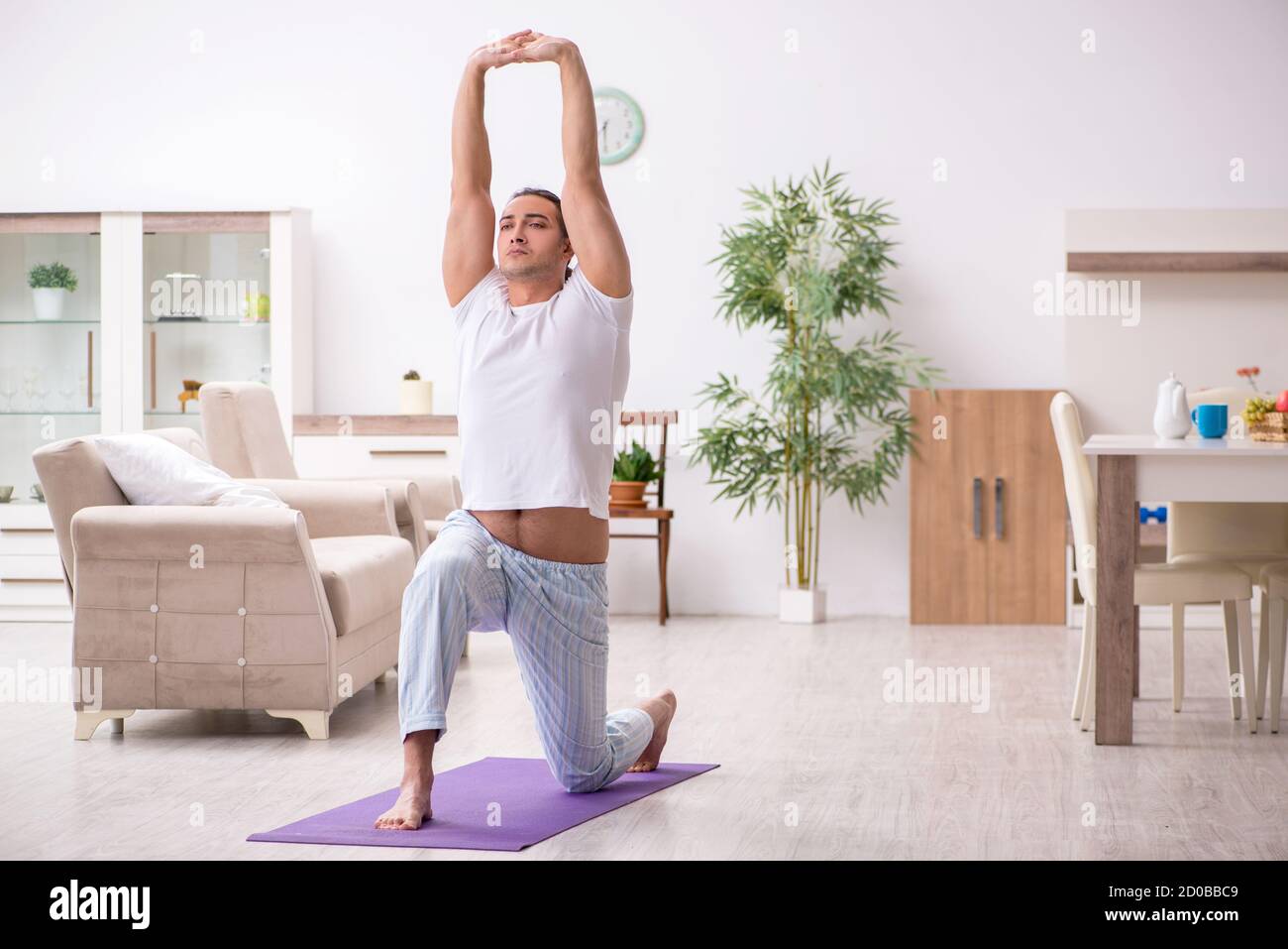 Man starting day with morning exercises Stock Photo - Alamy