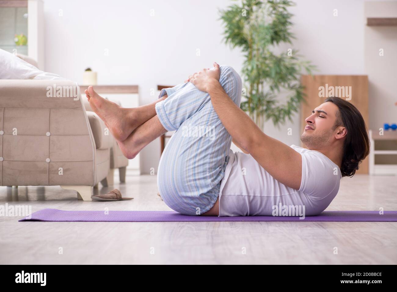 Man starting day with morning exercises Stock Photo - Alamy