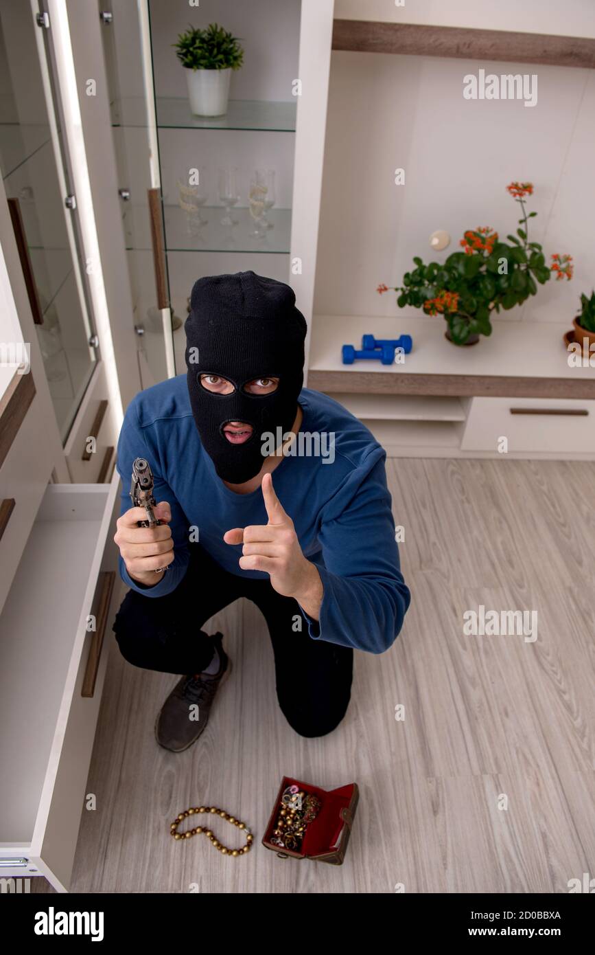 Camera view of robber stealing valuable things from the house Stock ...