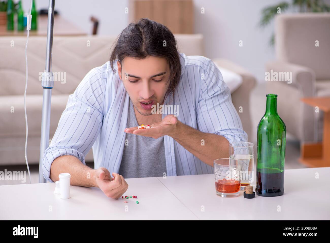 Man in alcohol addiction treatment concept Stock Photo - Alamy