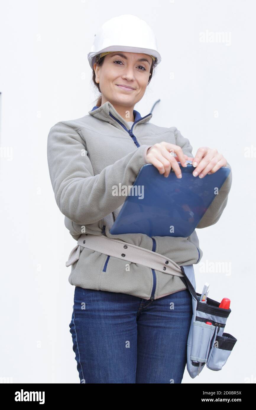 beautiful woman builder posing with blueprints Stock Photo - Alamy