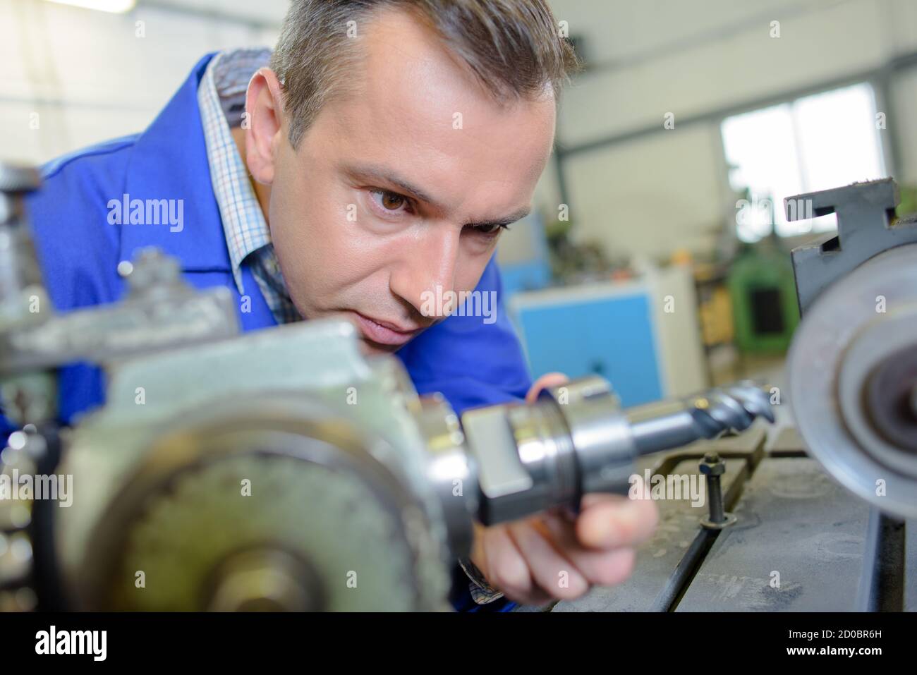 a machinist is fixing a machine Stock Photo - Alamy