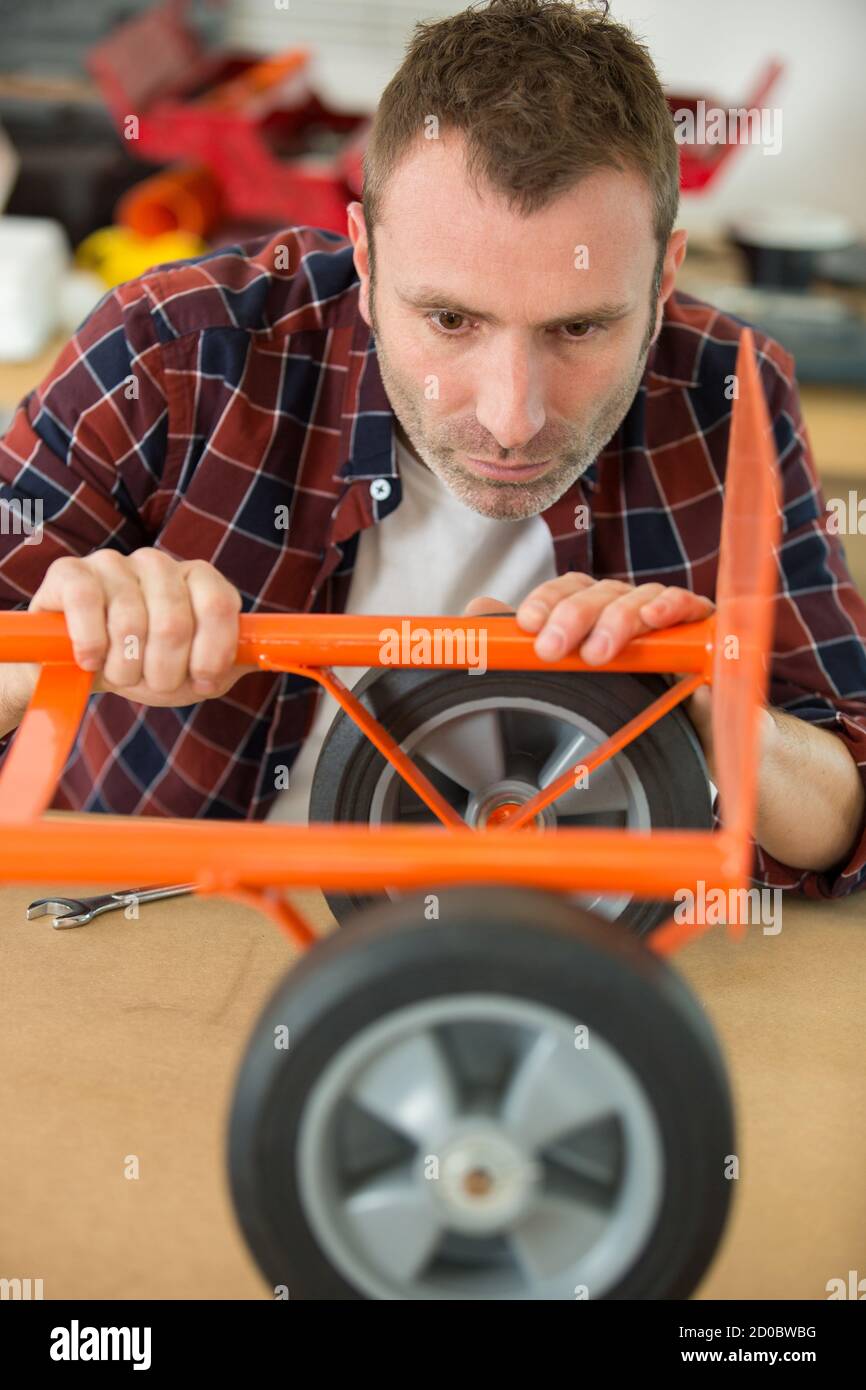 a man repairing a trolley Stock Photo - Alamy