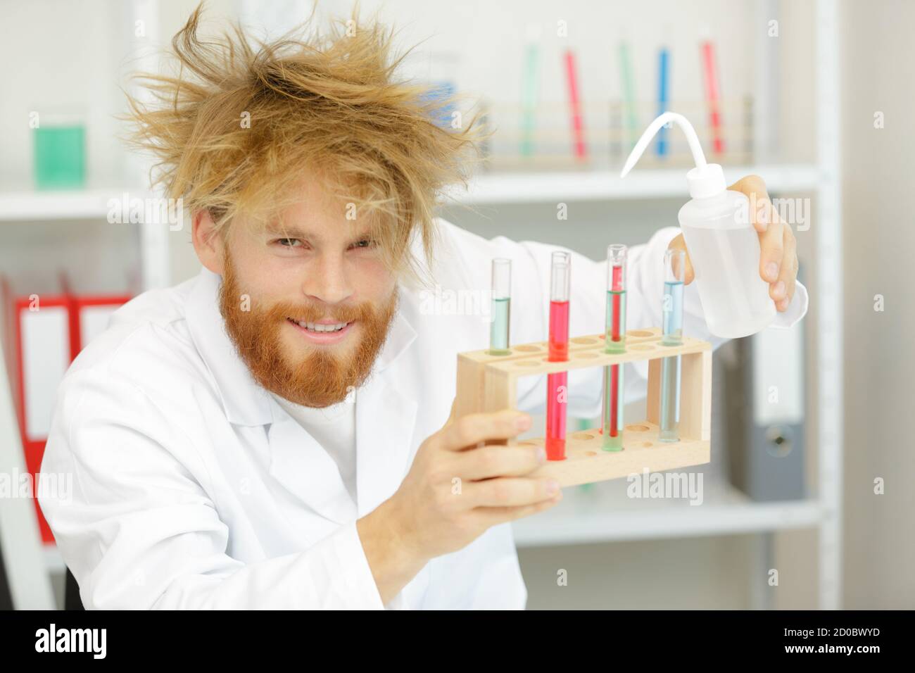 a crazy young man scientist Stock Photo - Alamy