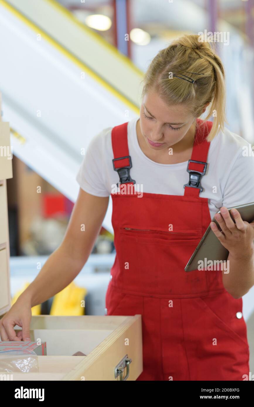 young woman worker of furniture store Stock Photo - Alamy