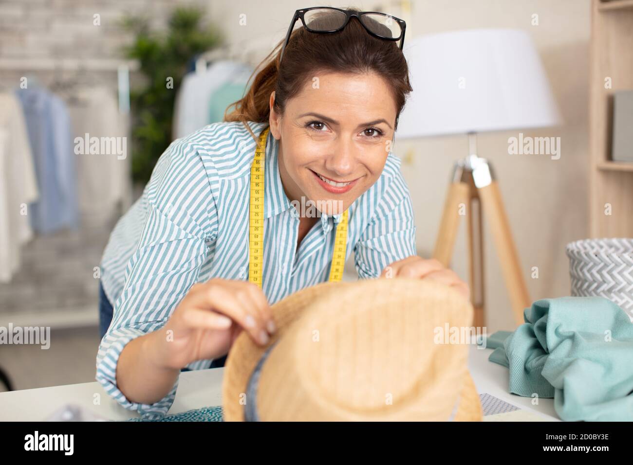 hat maker working on design in studio Stock Photo - Alamy