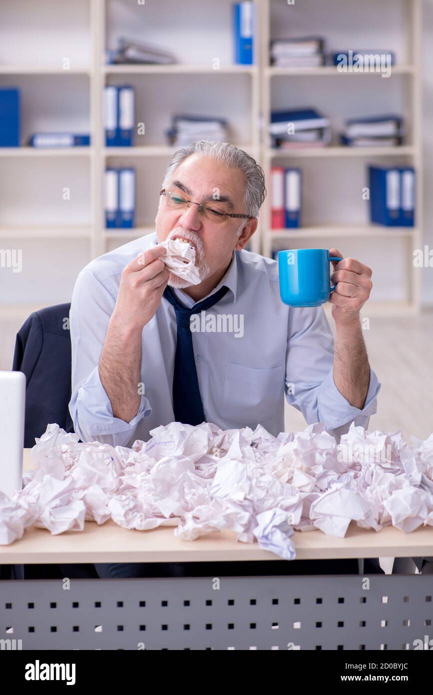 Old businessman rejecting ideas with lots of papers Stock Photo - Alamy