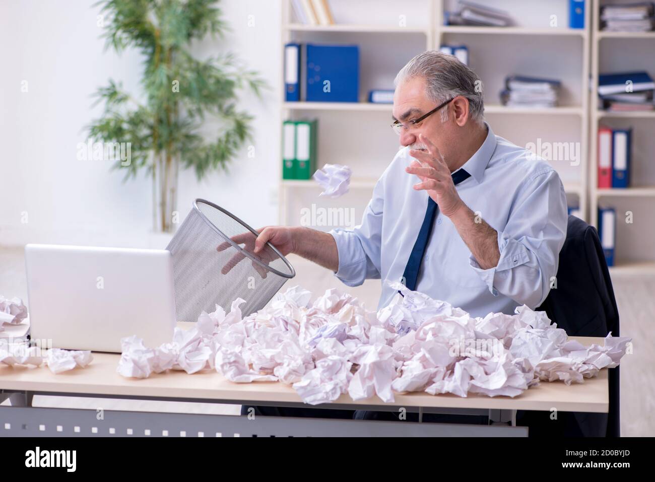 Old businessman rejecting ideas with lots of papers Stock Photo - Alamy
