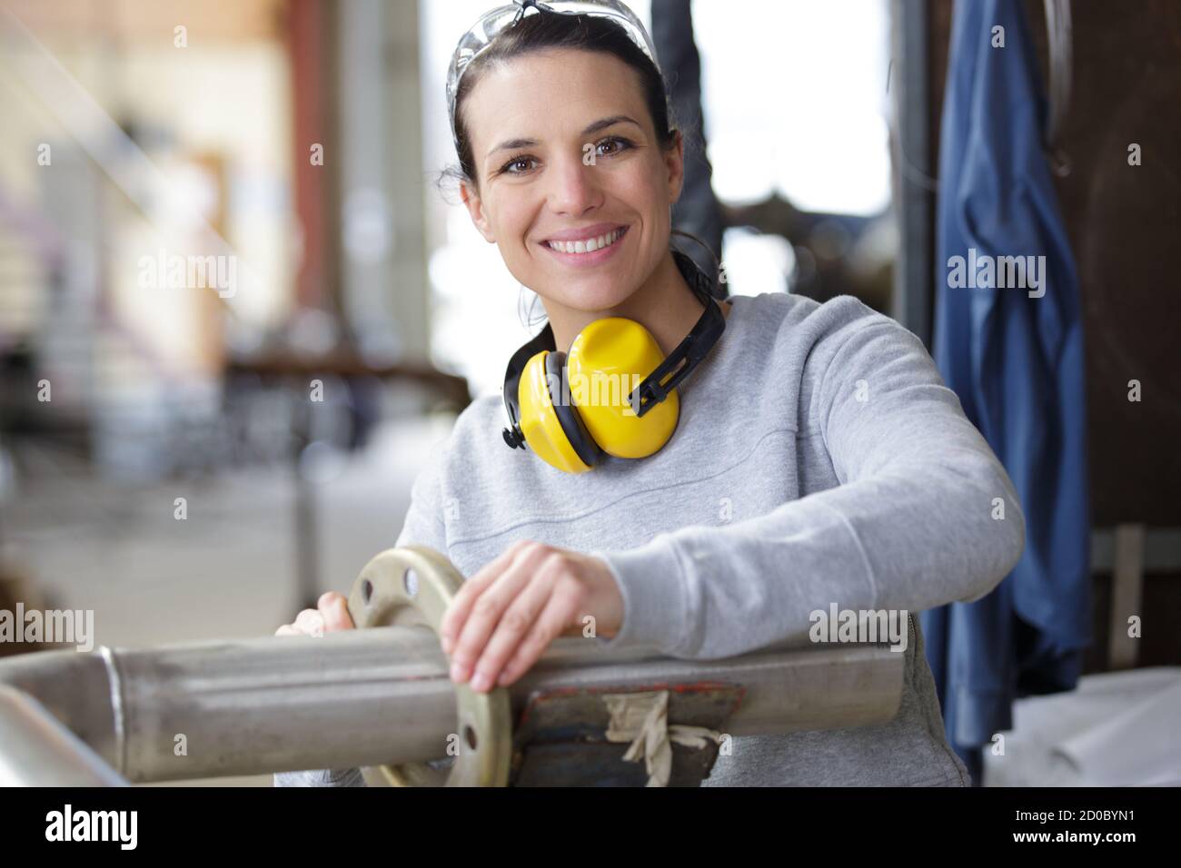 happy female engineer smiling at the camera Stock Photo - Alamy