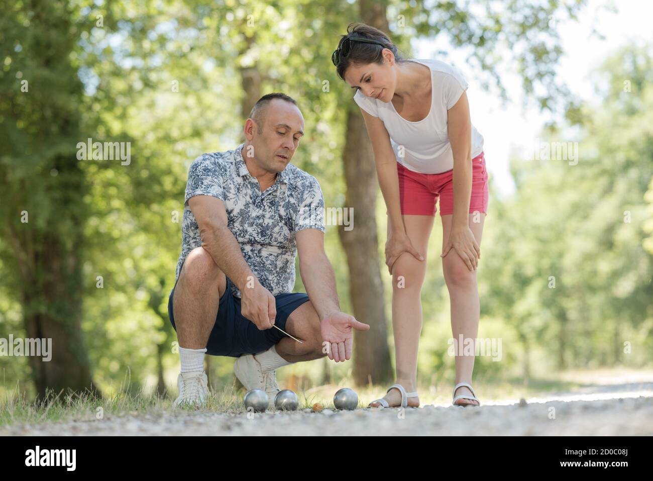 happy family of two generations playing bocce at a garden Stock Photo ...