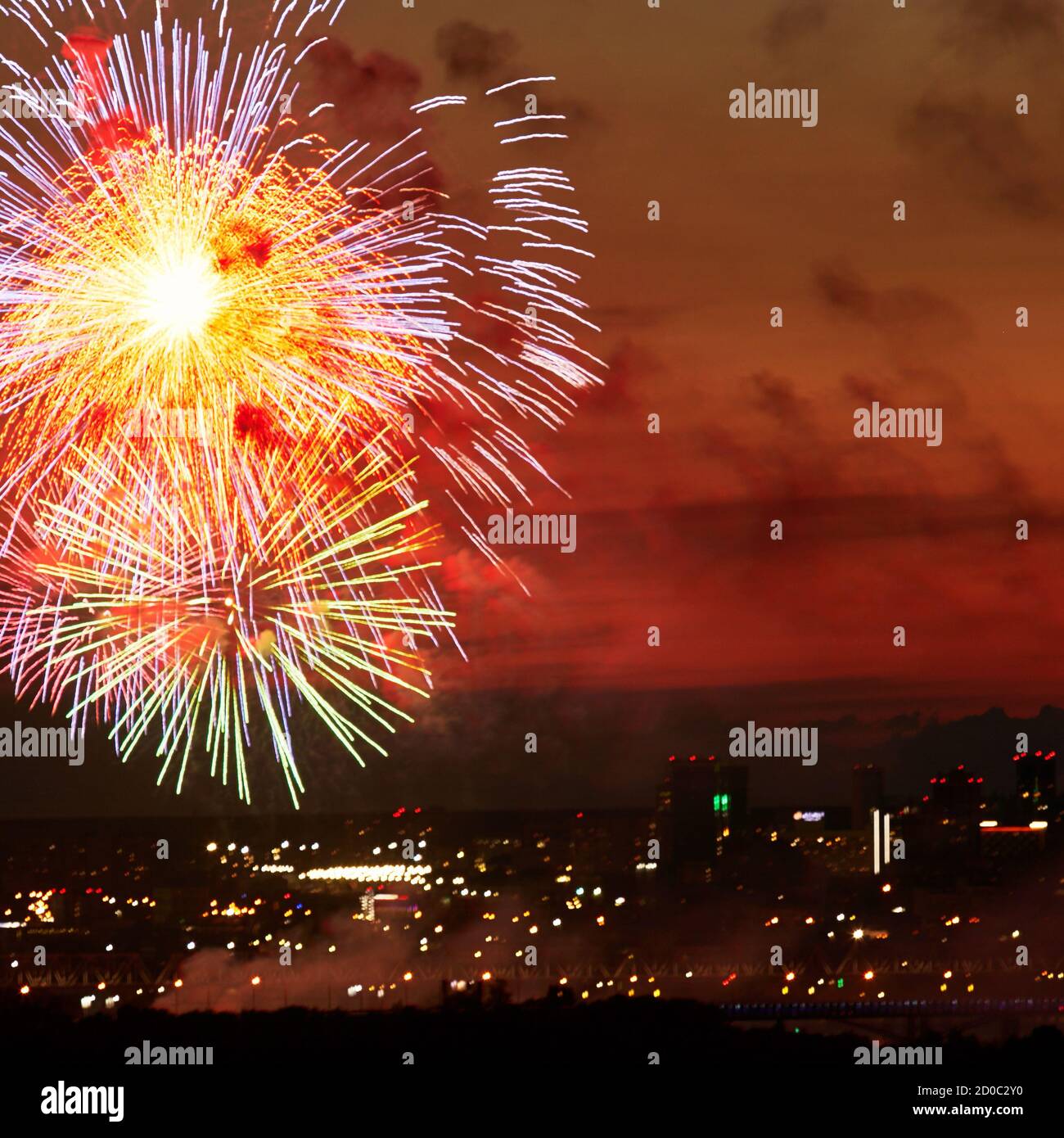 Fantastic fireworks over night city Stock Photo - Alamy