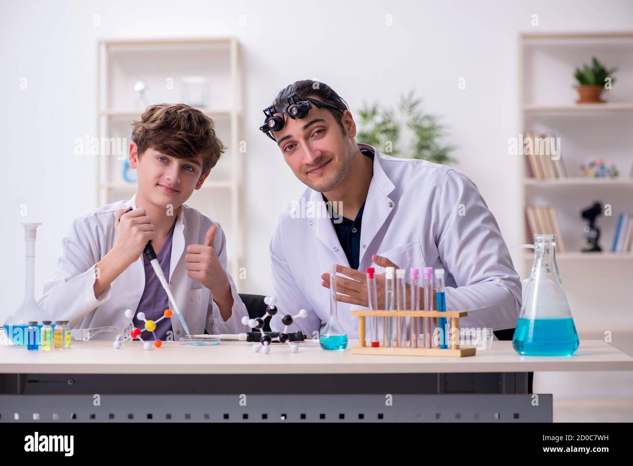 Young father and son chemists in the laboratory Stock Photo - Alamy