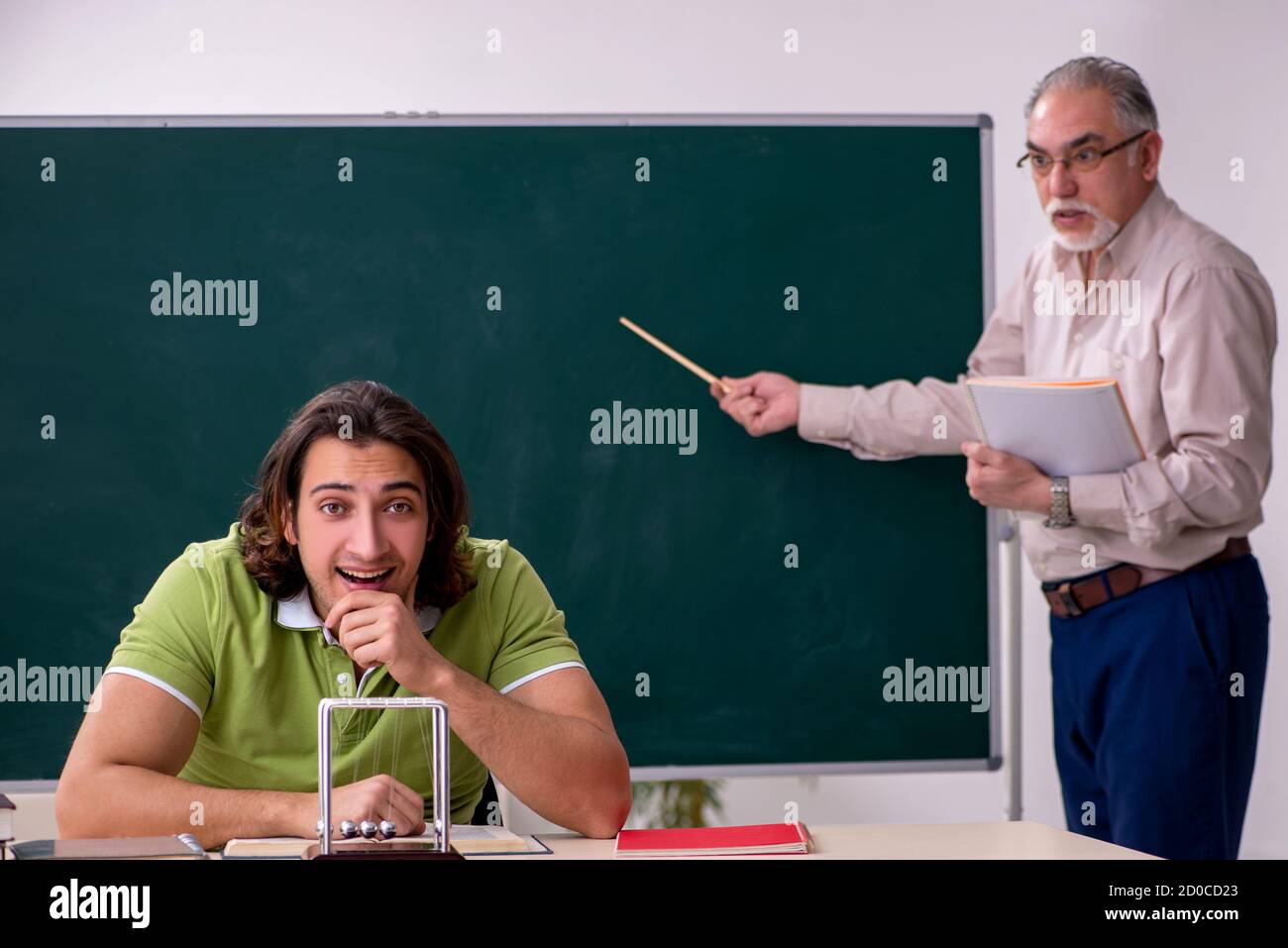 Old professor physicist and student in the classroom Stock Photo - Alamy