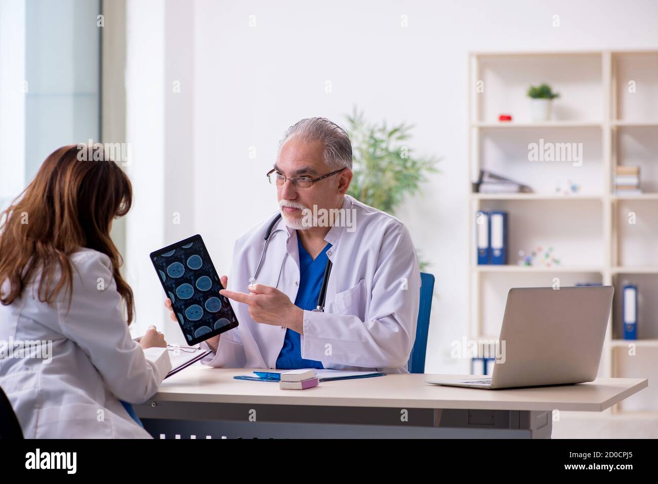 Medical assistant explaining radiography scan hi-res stock photography ...
