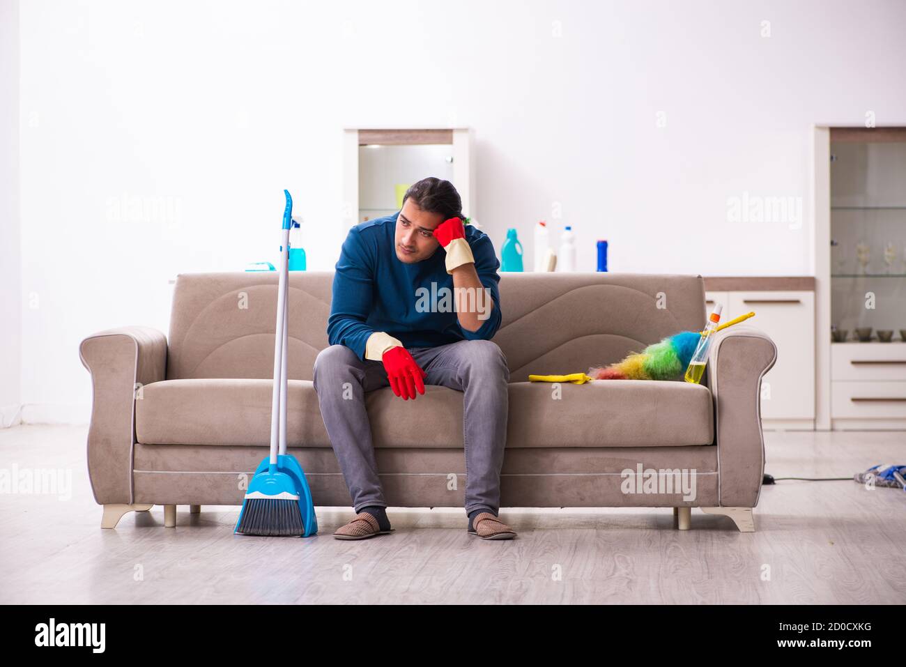 Young man husband doing housework at the home Stock Photo - Alamy